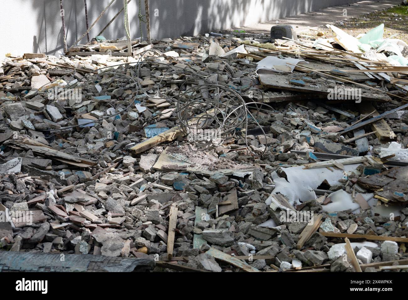 Construction waste. A pile of concrete debris with reinforcement ...