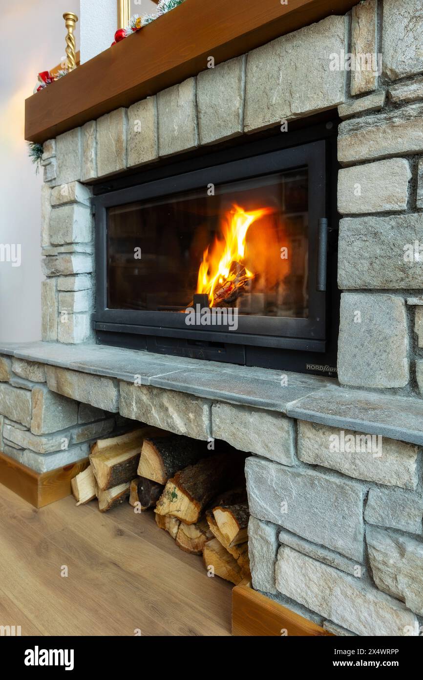 Stone Fireplace with Flames of burning fire, Rustic Style Cozy Home in ...