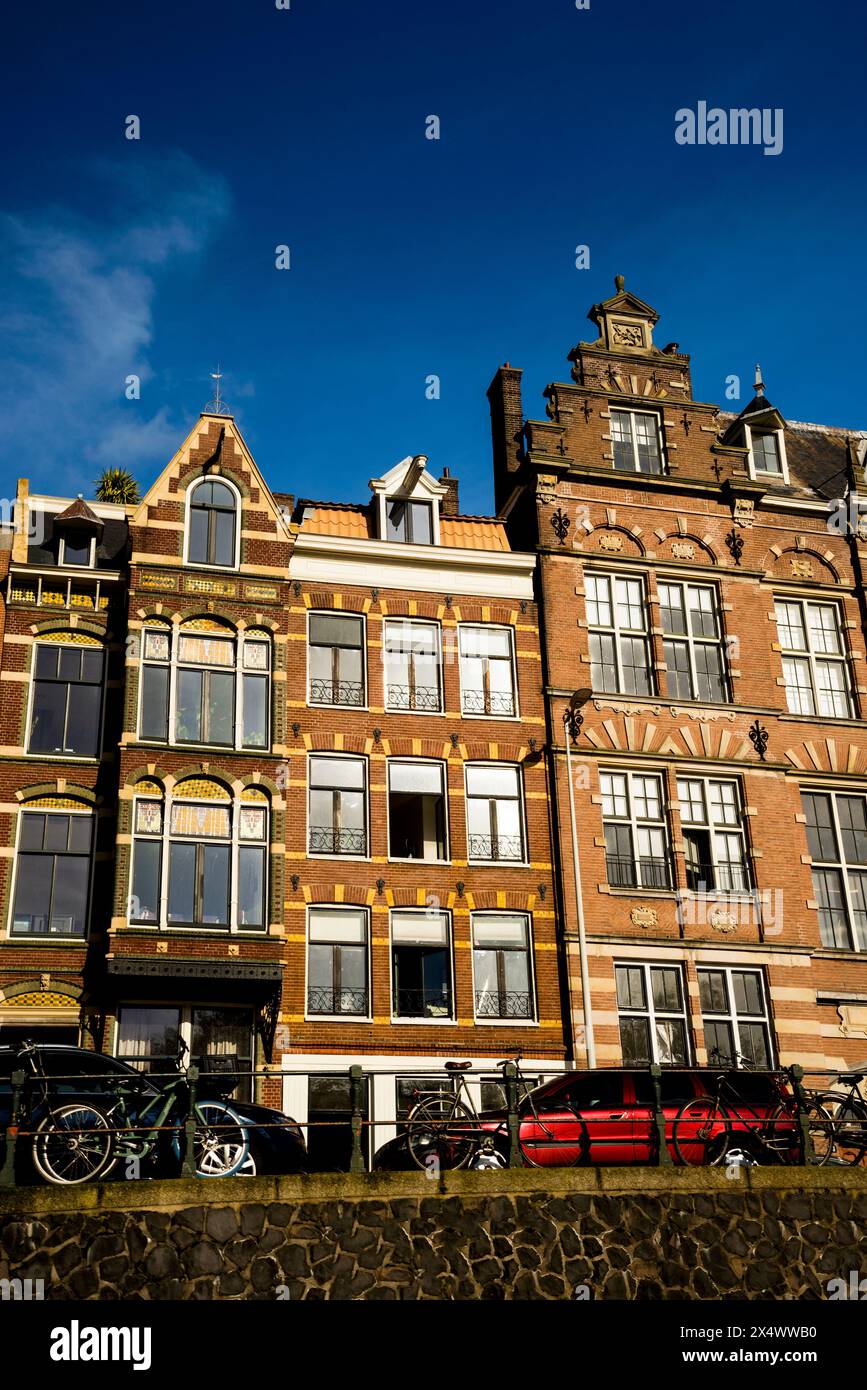 Architectural details of brick Dutch townhouses with elaborate gables ...