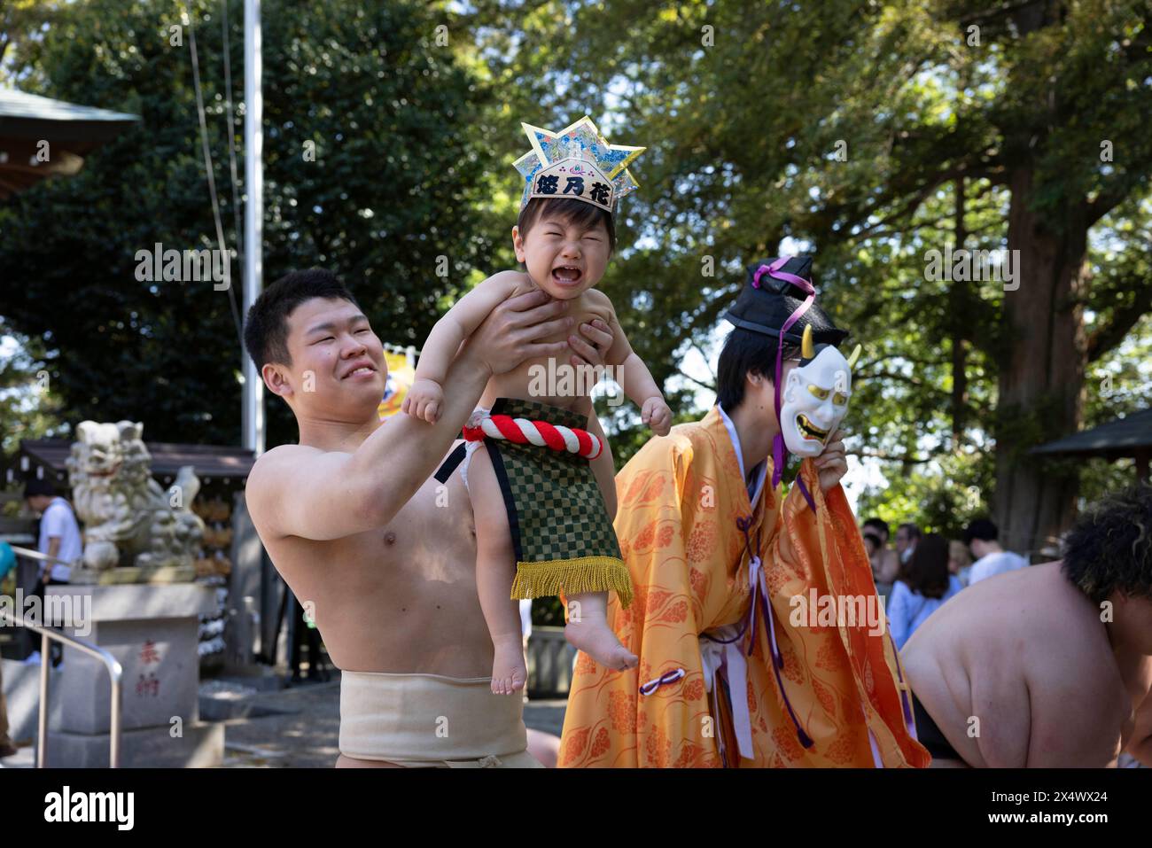 Yokohama, Japan. 05th May, 2024. Crying baby is being lifted in the air ...