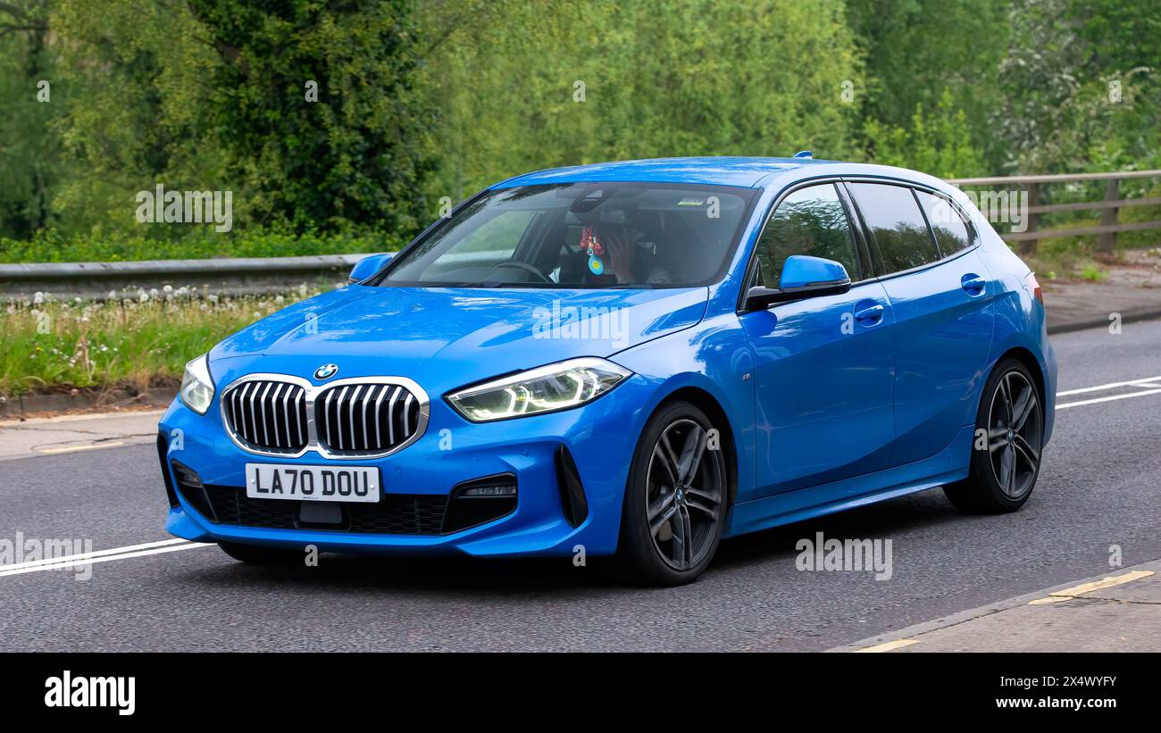 Milton Keynes,UK - May 3nd 2024: 2020 blue BMW 118 M sport car driving ...