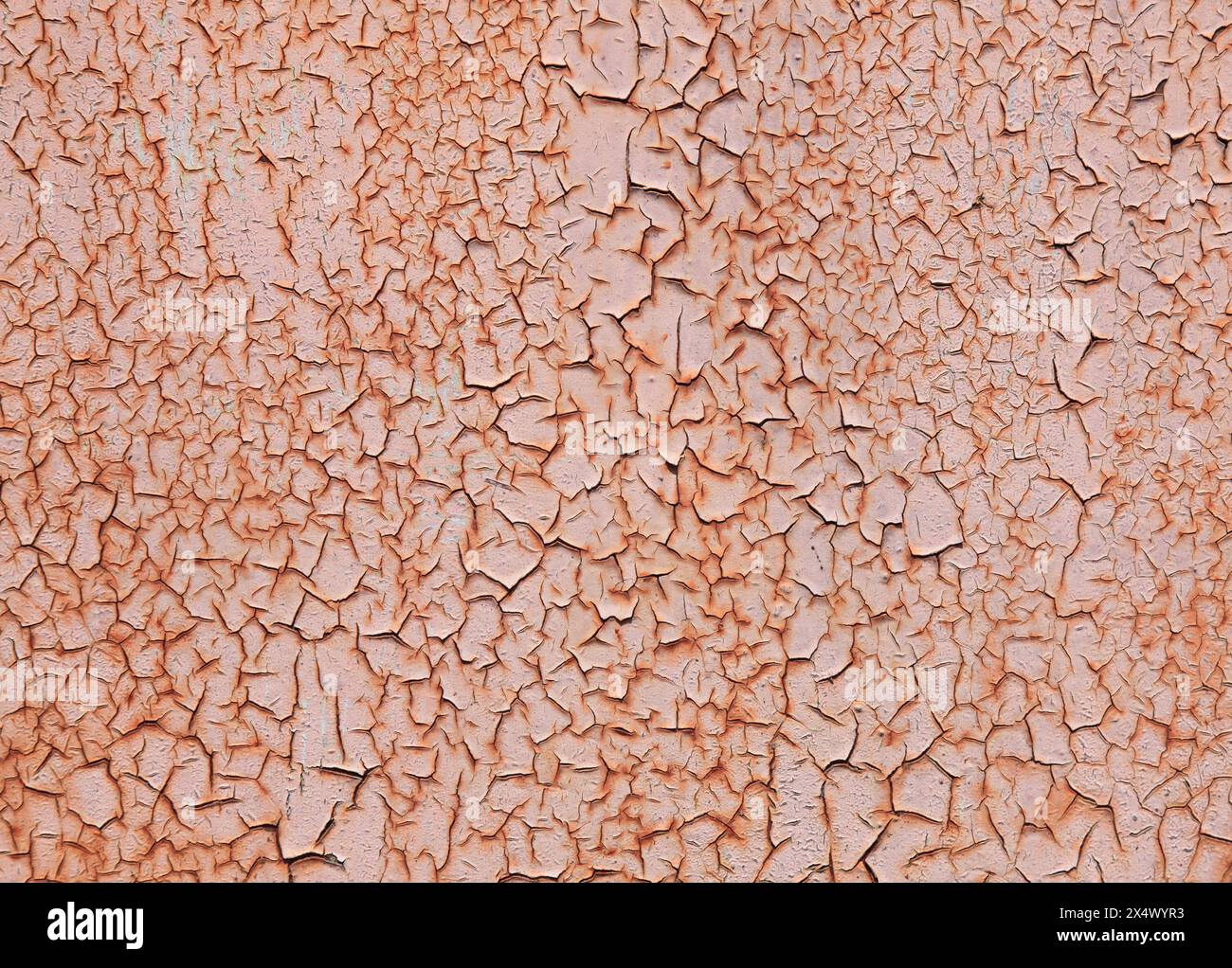 Pink metallic wall, background. Mangy surface with peeling and heavily ...