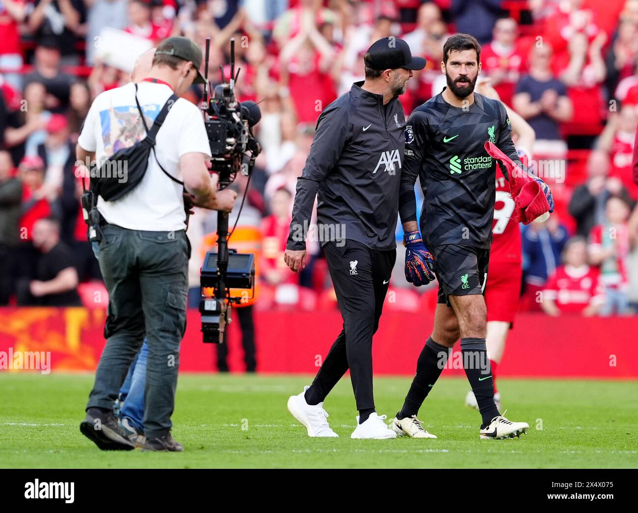 Liverpool manager Jurgen Klopp (left) speaks with Liverpool goalkeeper Alisson Becker after the ...