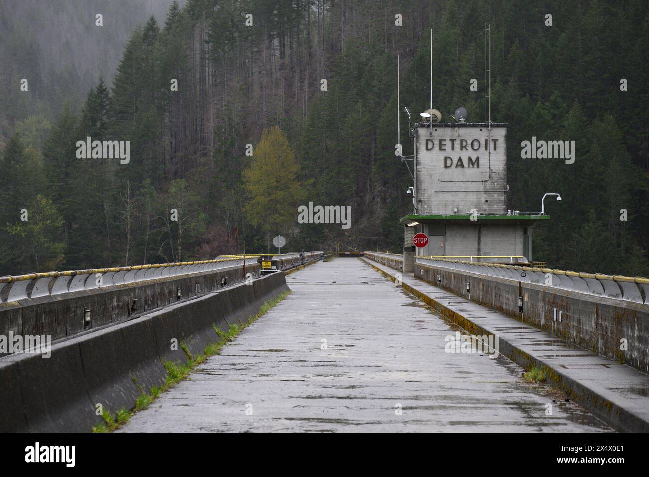 Detroit, OR, USA - April 25, 2024; Damp road across Detroit Dam on wet ...