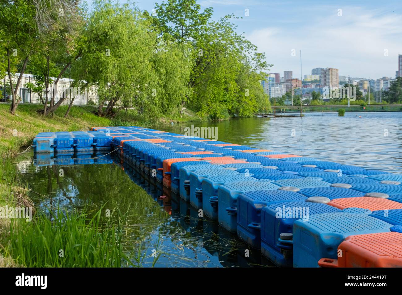 Floating pier made of composite plastic blocks on the river, sea ...
