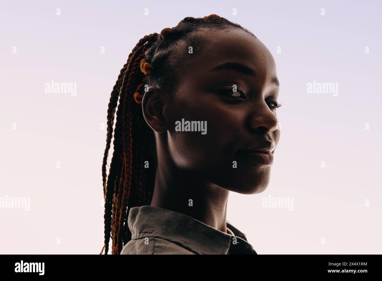 Confident African woman with braids and a ponytail. Captivating ...
