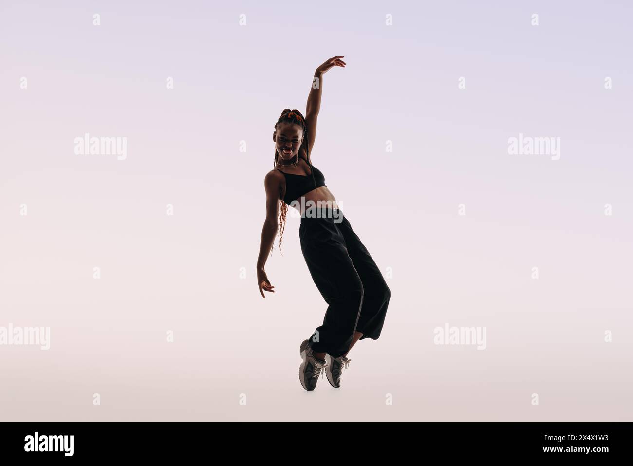 Expressive female dancer with confident posture and flexible and toned ...