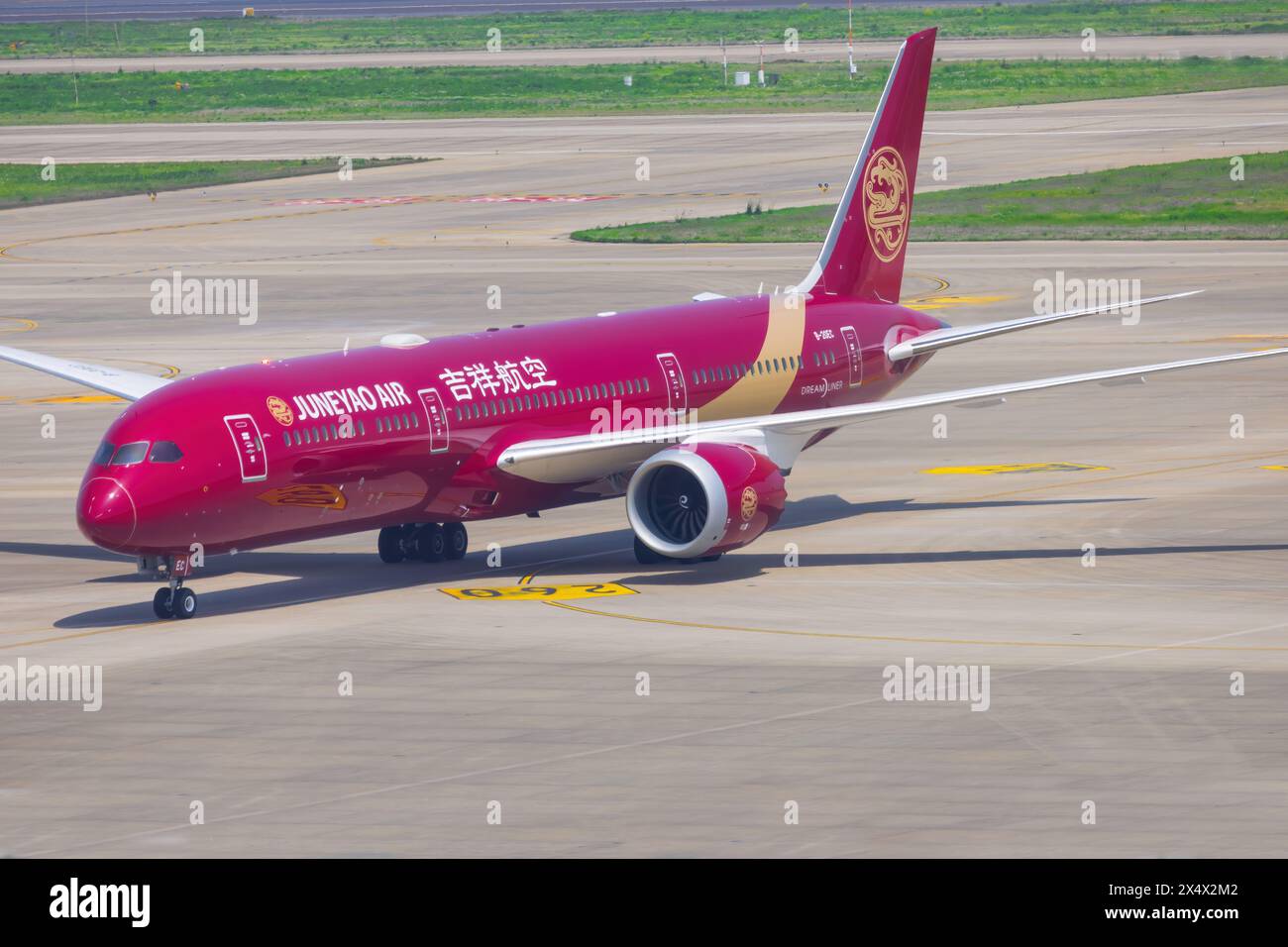 First aircraft Boeing 787 painted in "Oriental Ruby" of Juneyao Airlines at Shanghai Hongqiao ...