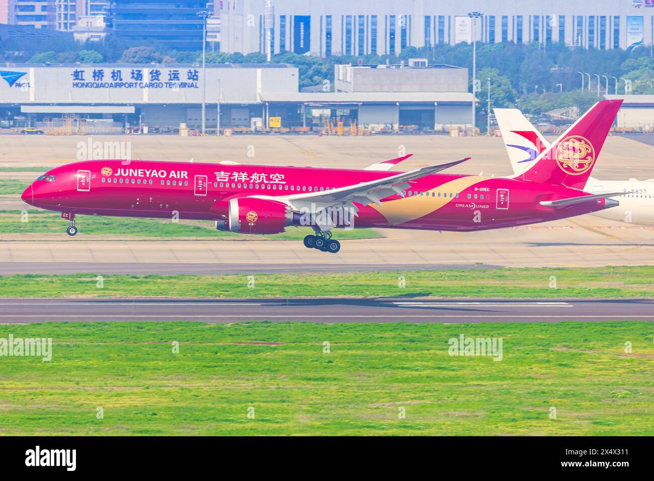 First aircraft Boeing 787 painted in "Oriental Ruby" of Juneyao Airlines at Shanghai Hongqiao ...