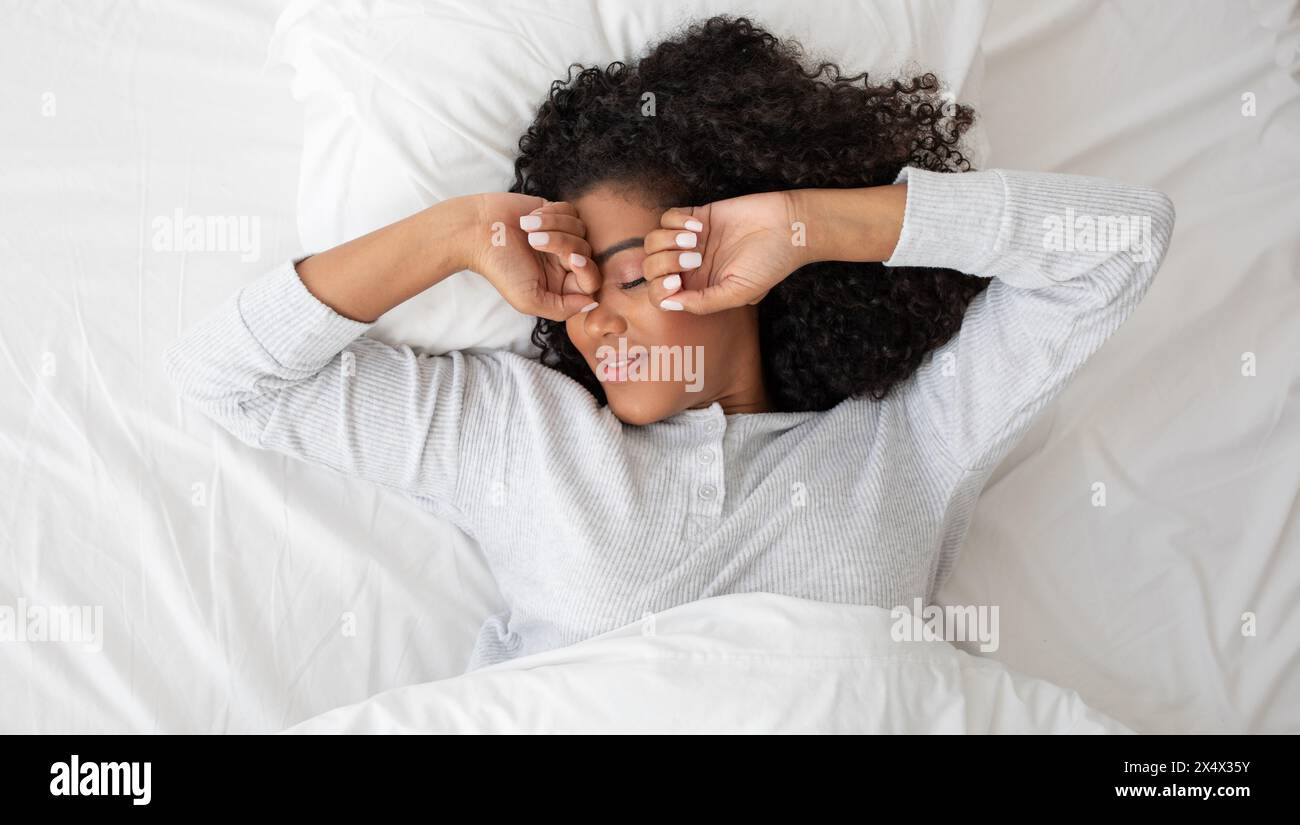 Latin woman laying in bed hi-res stock photography and images - Alamy
