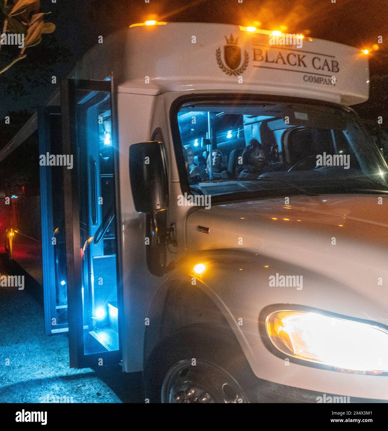 A small shuttle bus with an open door Stock Photo - Alamy