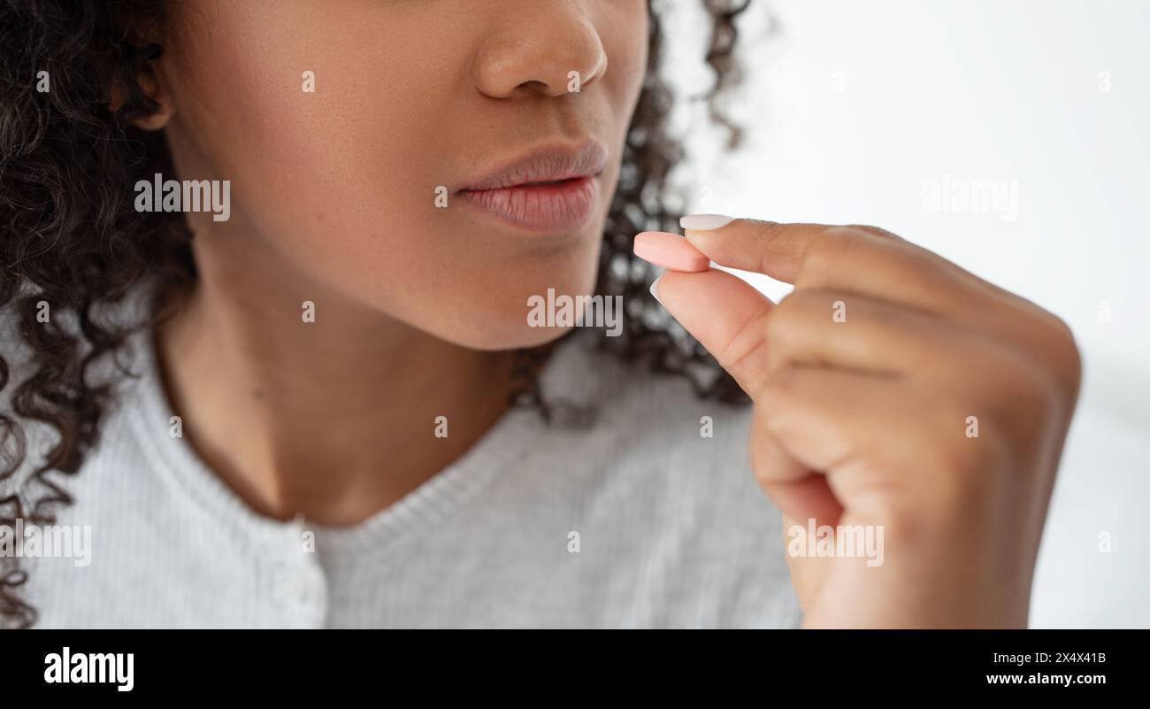 Young Woman Taking Medication During Morning Routine Stock Photo - Alamy