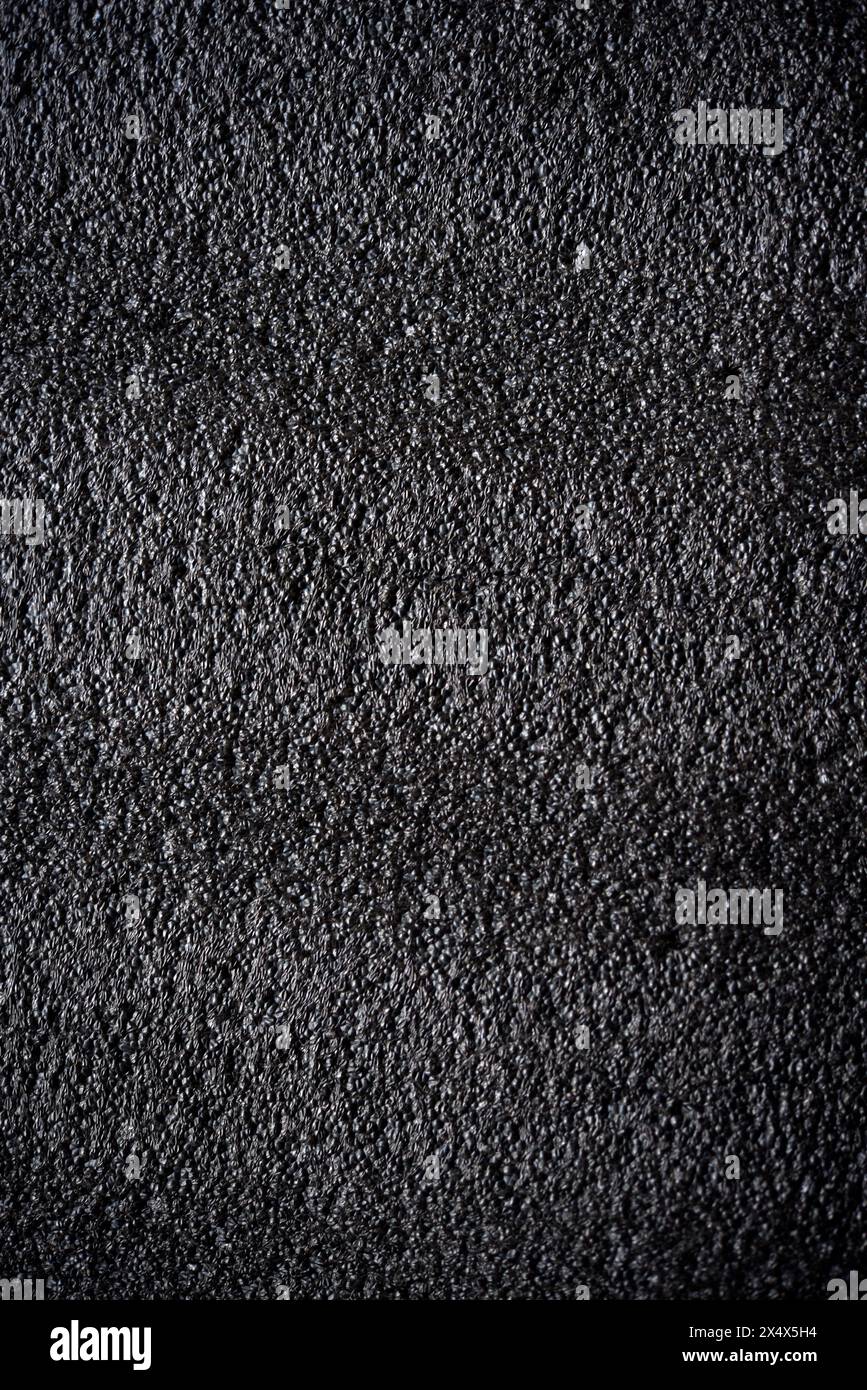 Black porous porous foam background. Background texture of black foam ...