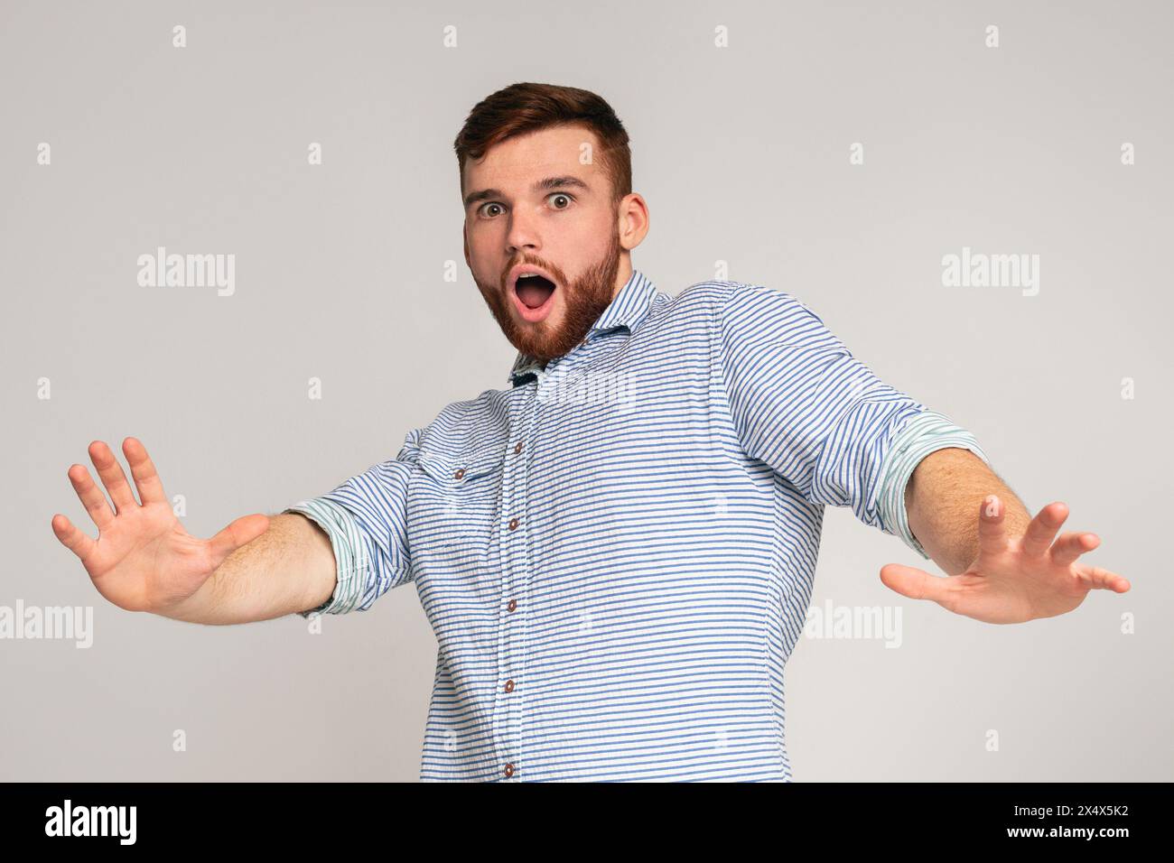 Portrait of scared man with open mouth Stock Photo - Alamy