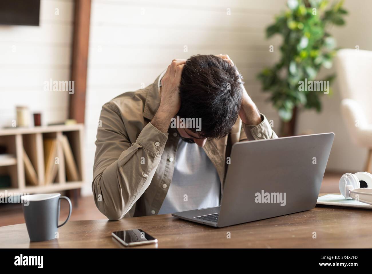 Frustrated Young Man Feeling Overwhelmed at Work During Early Hours ...
