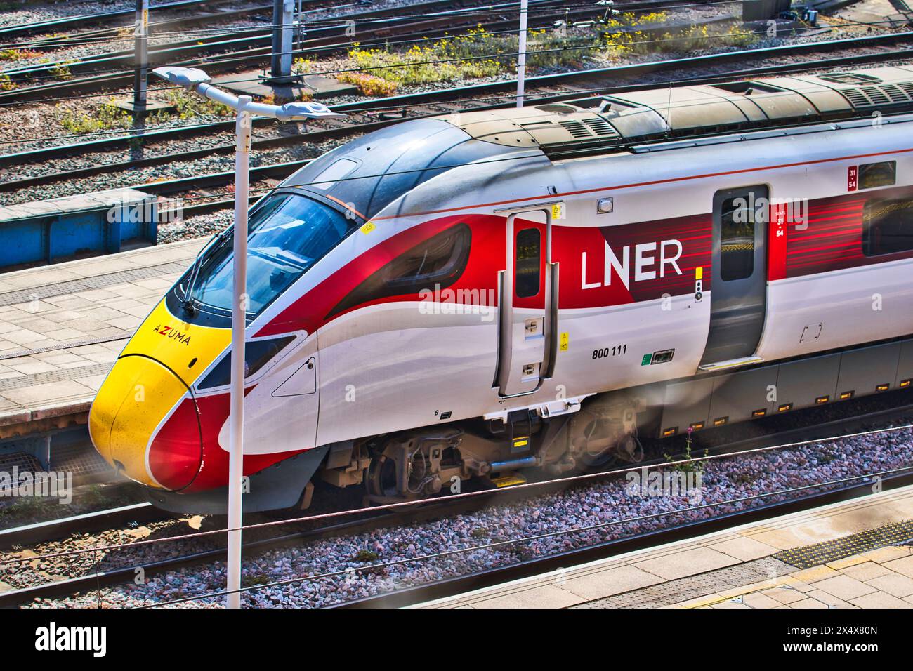 A modern LNER train at a station, showcasing its sleek design and ...