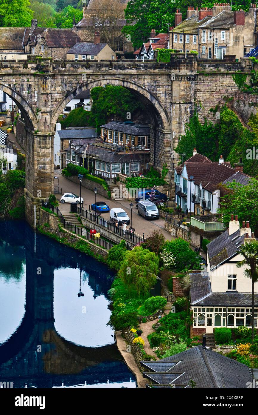 Scenic view of a historic stone bridge over a tranquil river in a ...