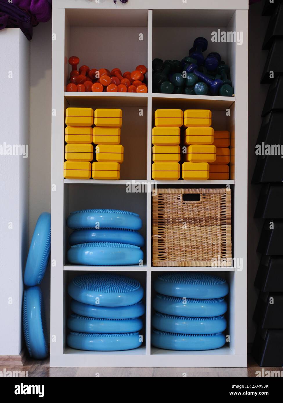 A white shelf with blue and yellow items on it Stock Photo - Alamy