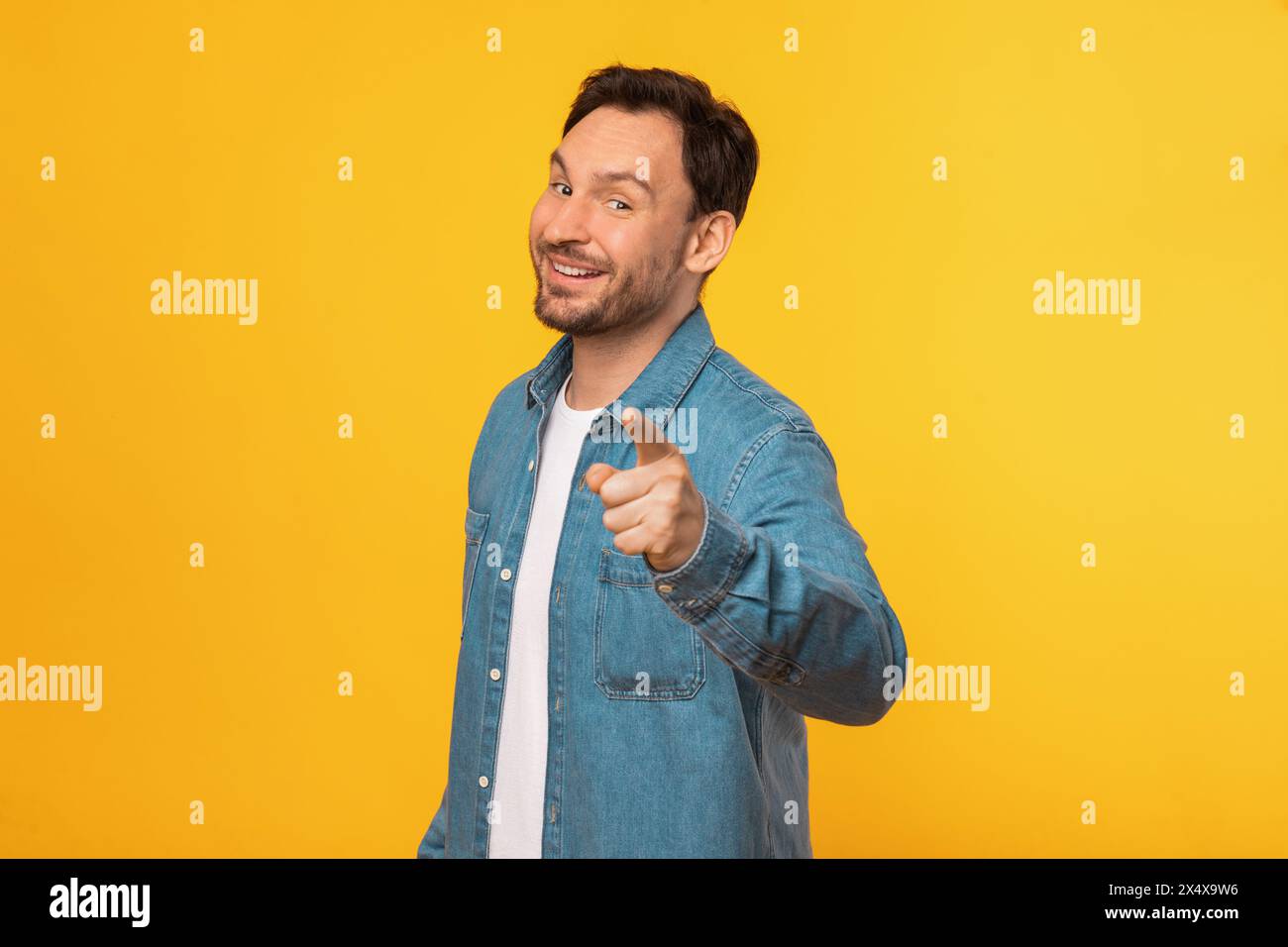 Casual man pointing camera inviting hi-res stock photography and images ...