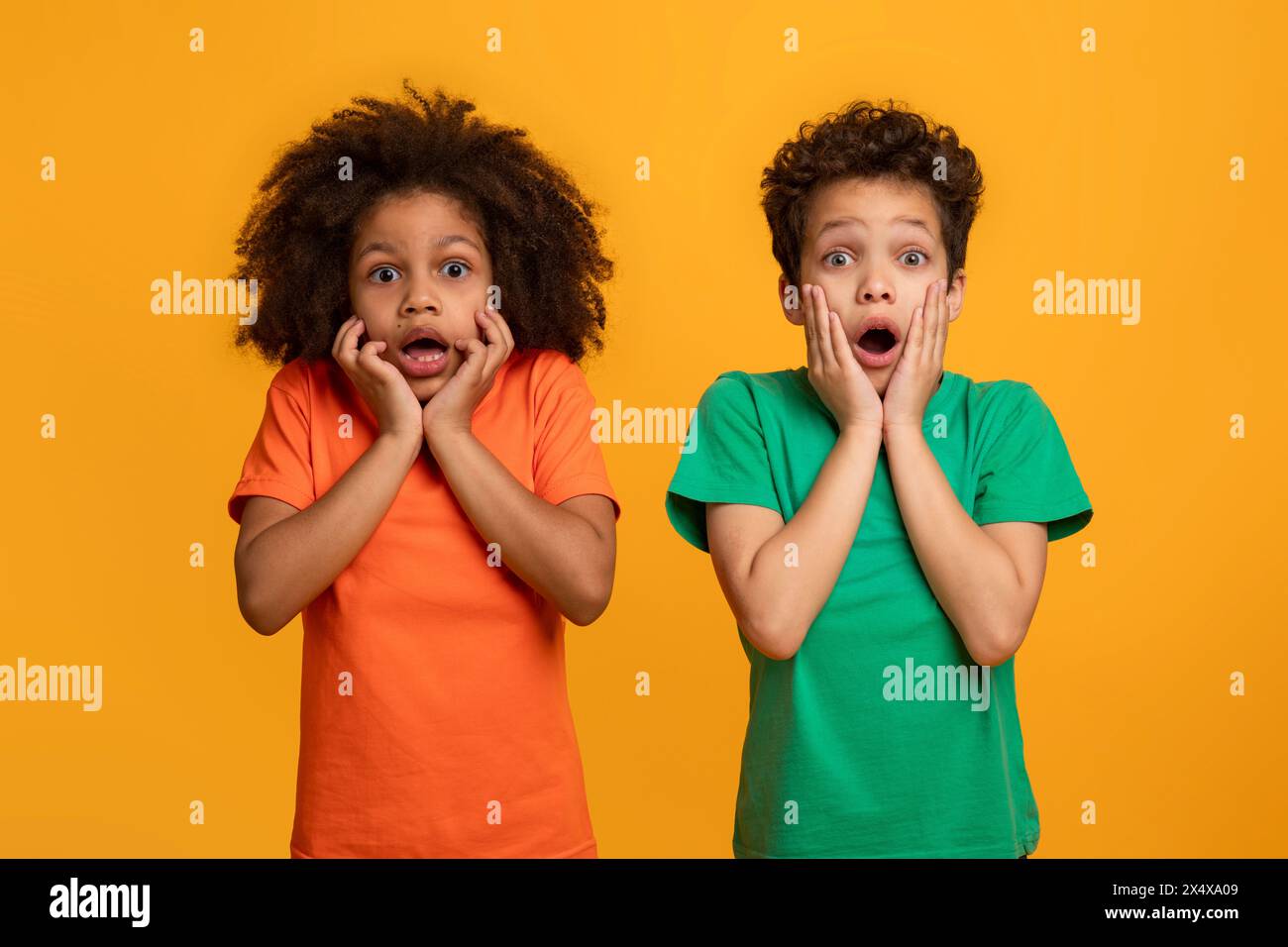 Two Children Expressing Surprise With Wide Eyes Stock Photo - Alamy
