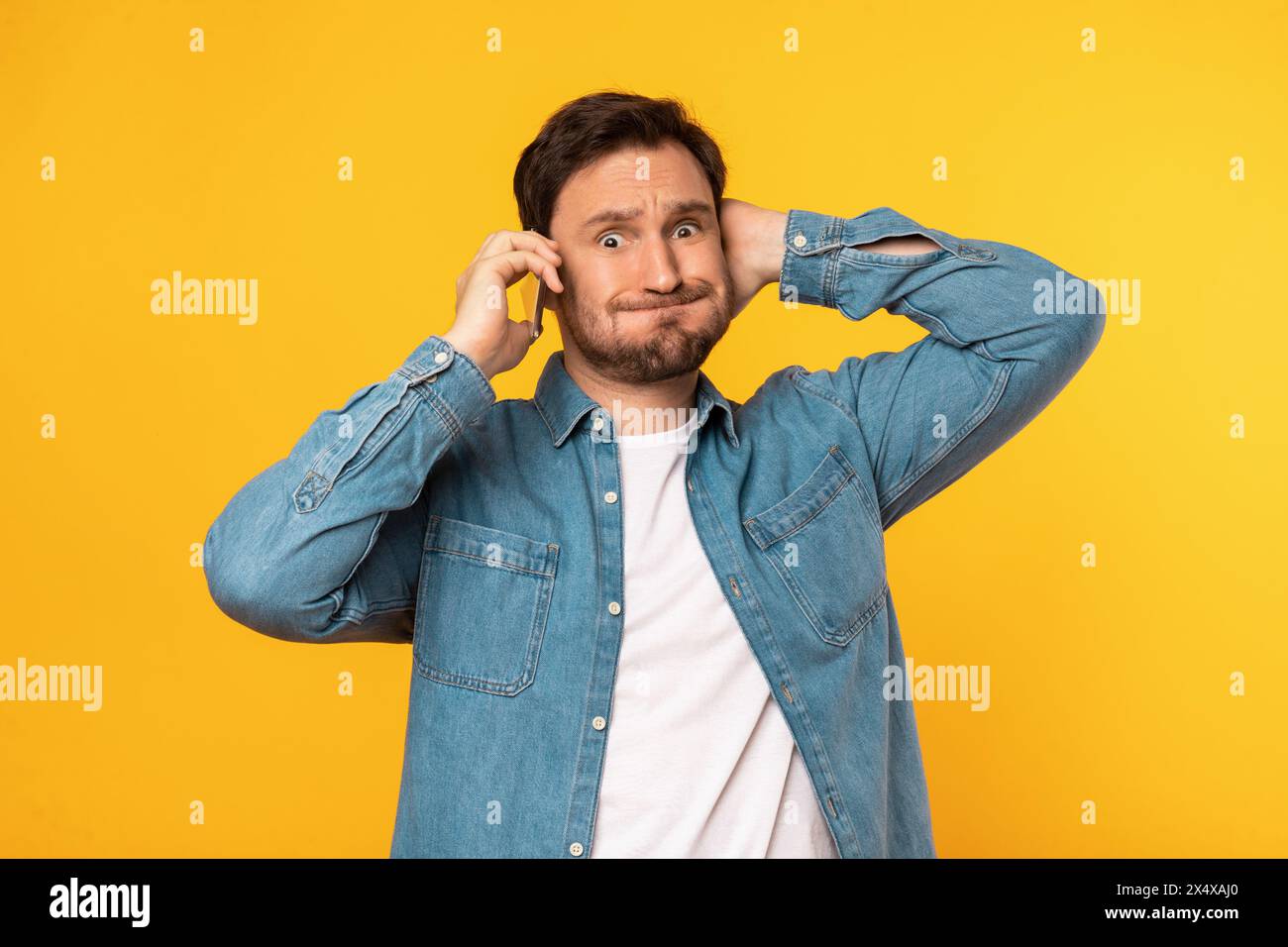 Man covering ears phone hi-res stock photography and images - Alamy