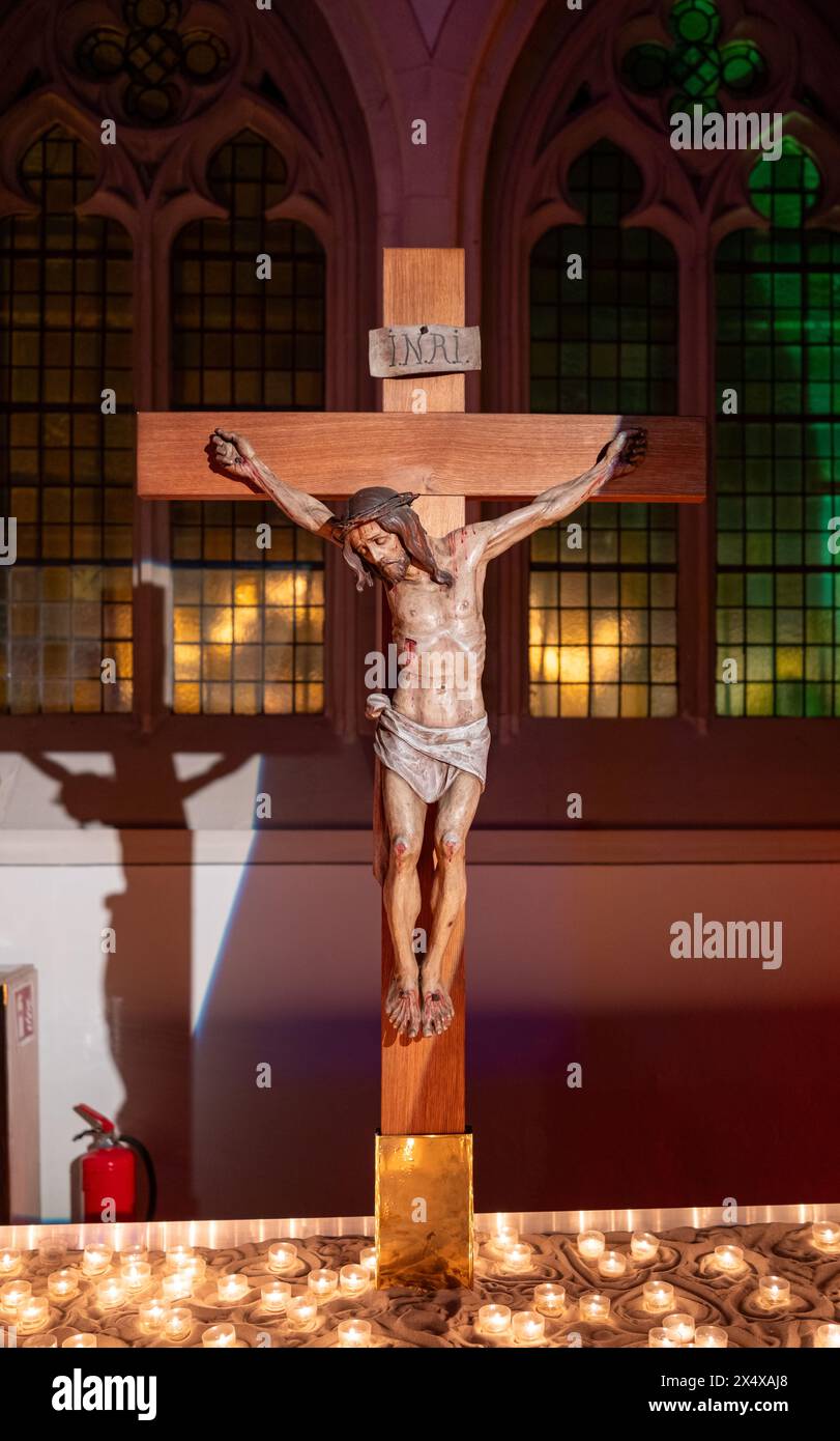 A crucified figure of Jesus in the church and his shadow reflected on ...