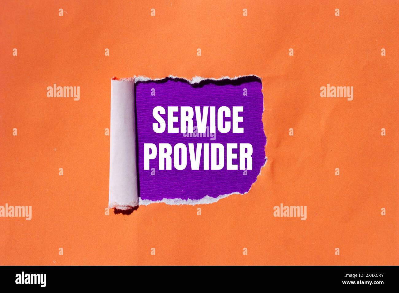 Service provider words written on ripped orange paper with purple ...