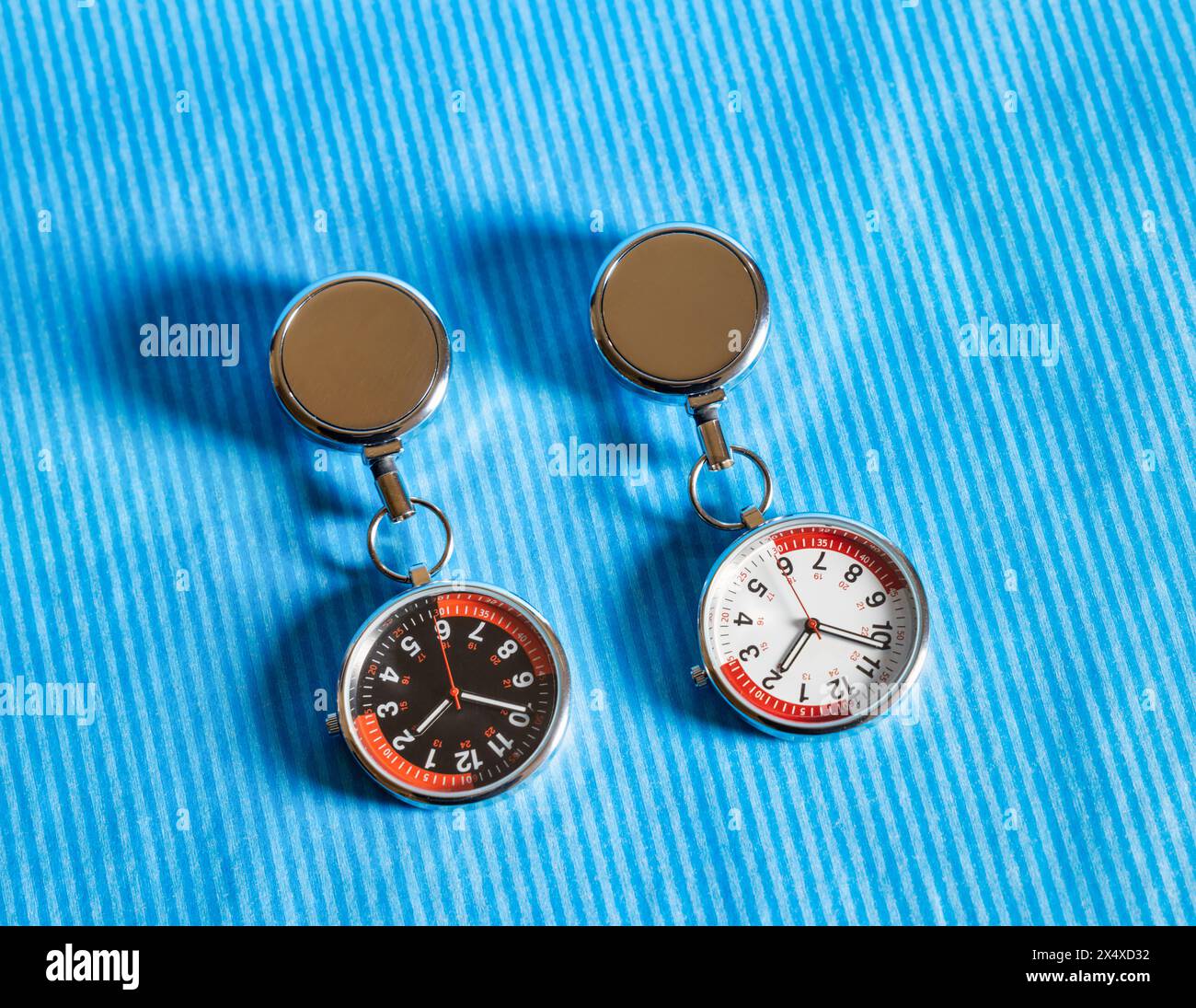 nurse watch FOB with label, studio shot on blue stripes background ...