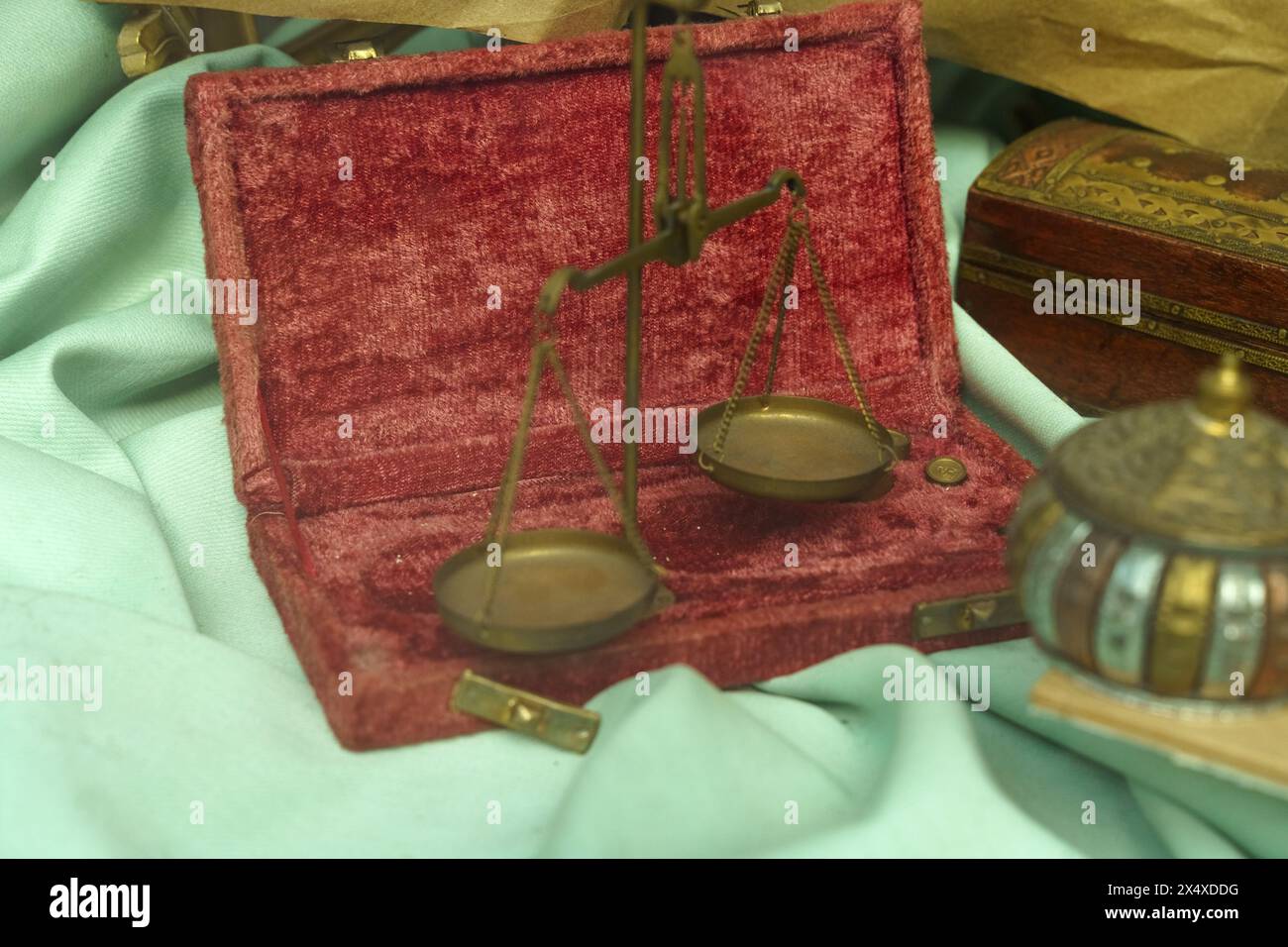 A red velvet case holding a scale inside, showcasing precision and ...