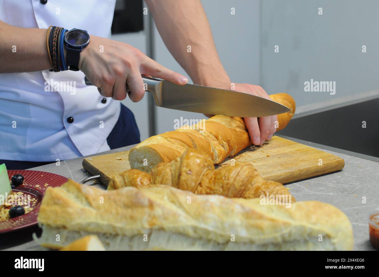 Chefs hands cut bread hi-res stock photography and images - Alamy
