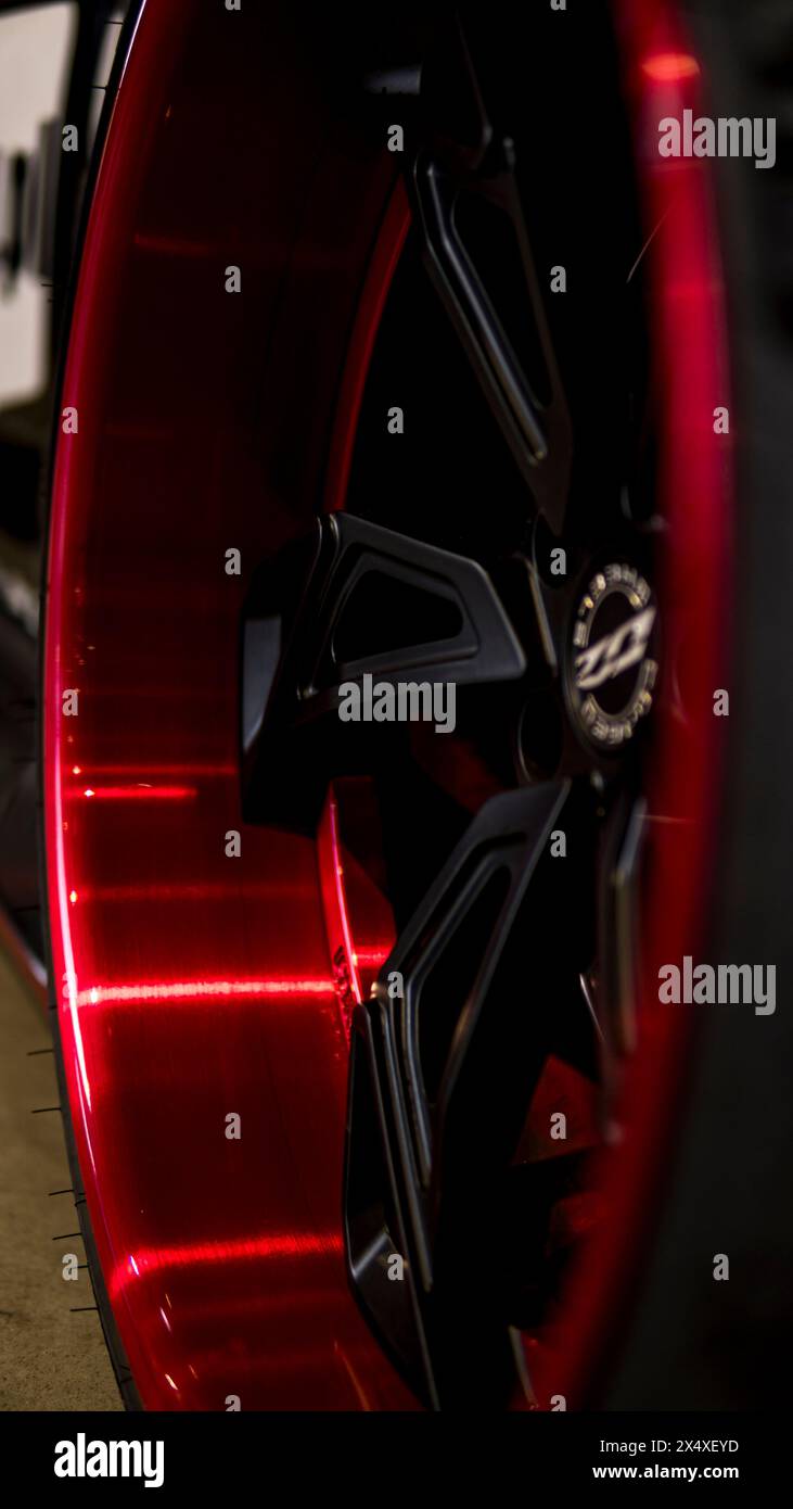 Detail of a red wheel rim of a sport car Stock Photo - Alamy