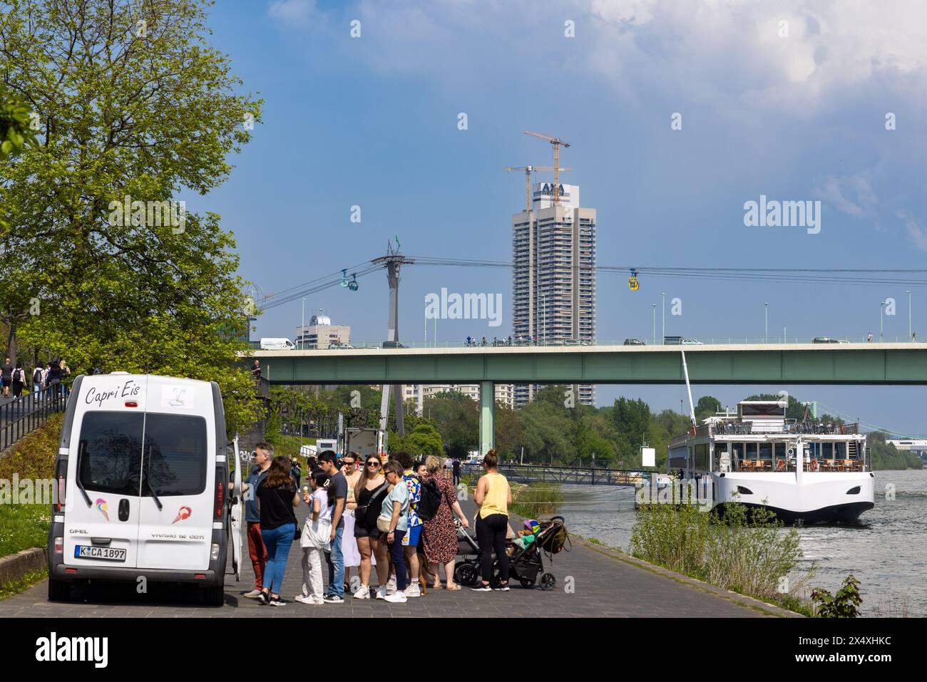 People enjoying warm spring weather on Rhine Promenade in Cologne Stock ...