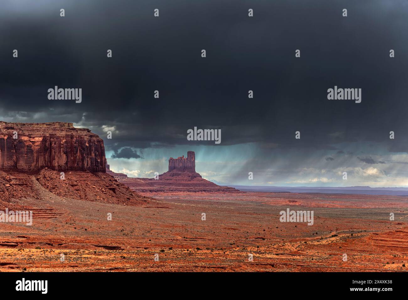 Monument Valley during a dark, eerie store creting an ominous look and ...