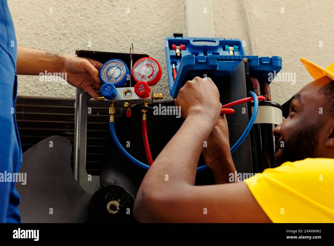 Seasoned mechanics commissioned by client to do maintenance on hvac ...