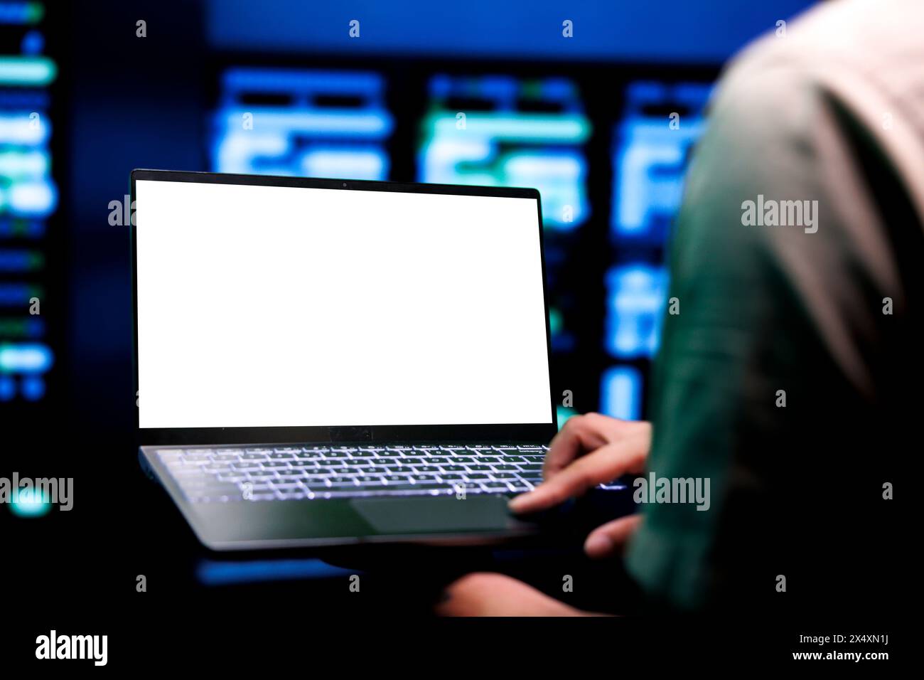 Skilled programmer conducting annual auditing of high tech facility servers using mock up laptop ...