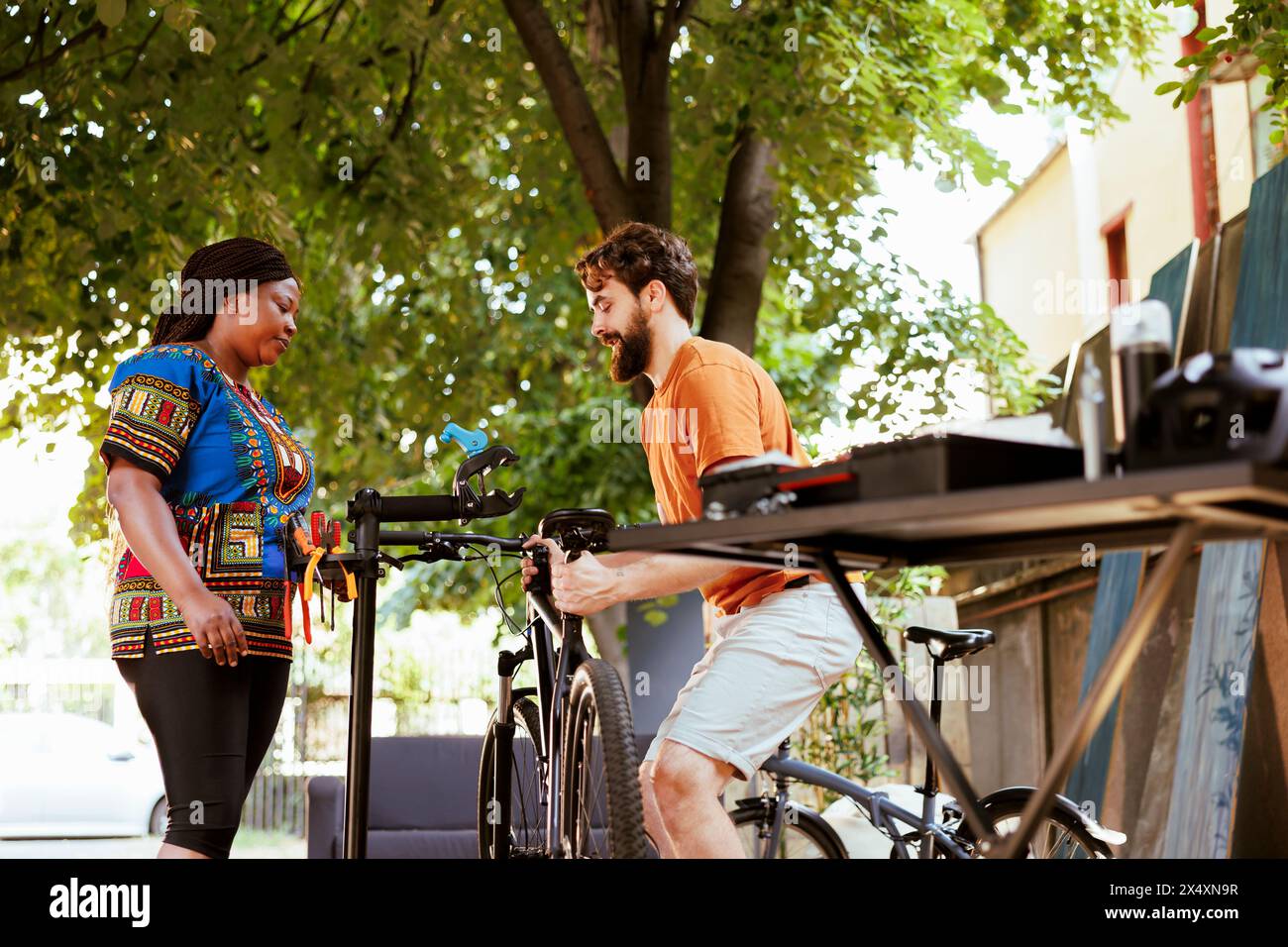 Caucasian man with assistance from african american woman are carefully ...