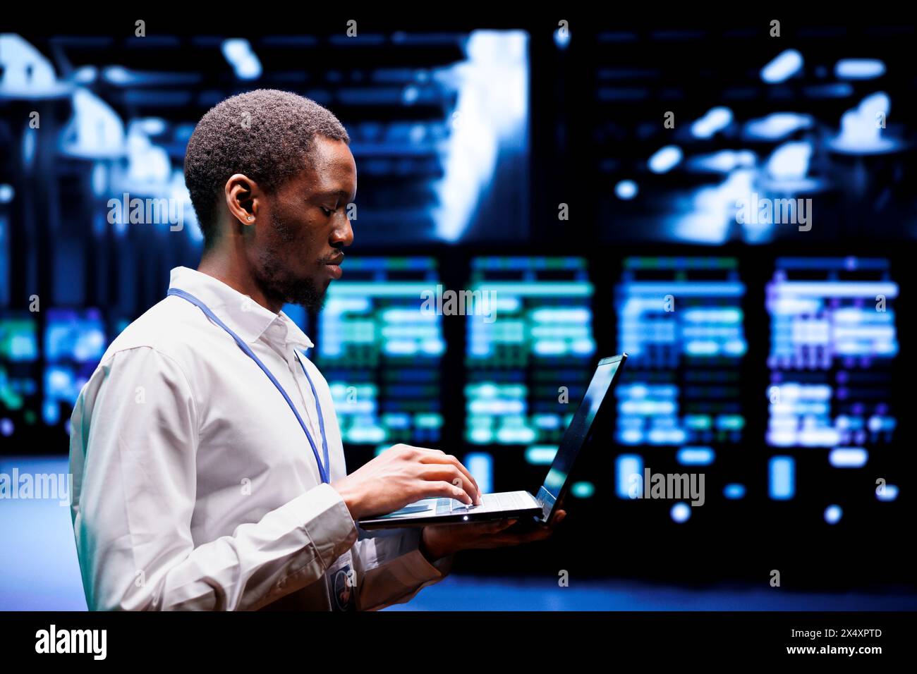 African american system administrator typing supercomputer hub ...