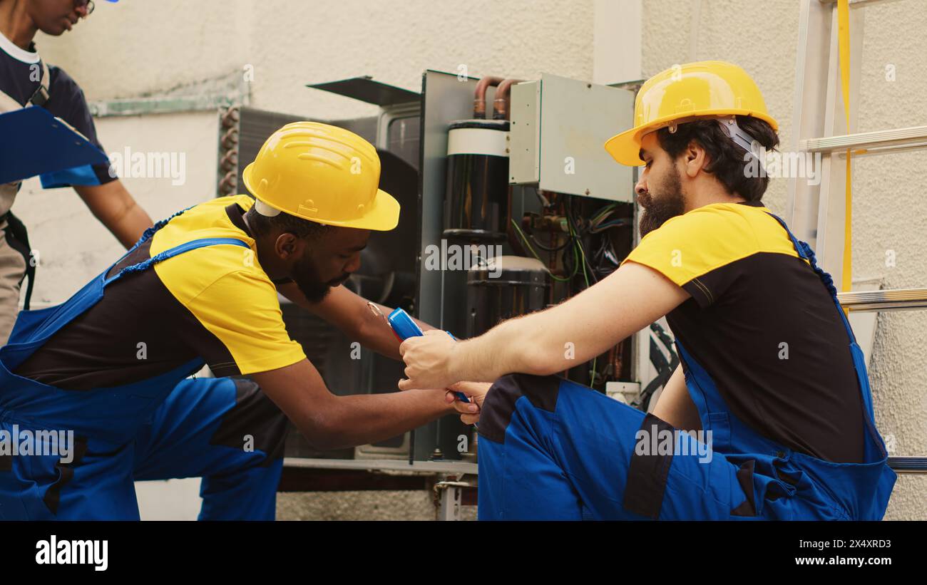 Skilled expert assembling professional pressure benchmarking tool to ...