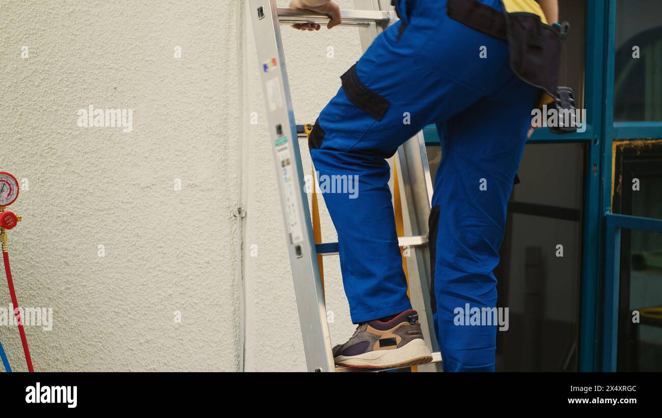 Expert repairman in professional uniform with technical equipment ...