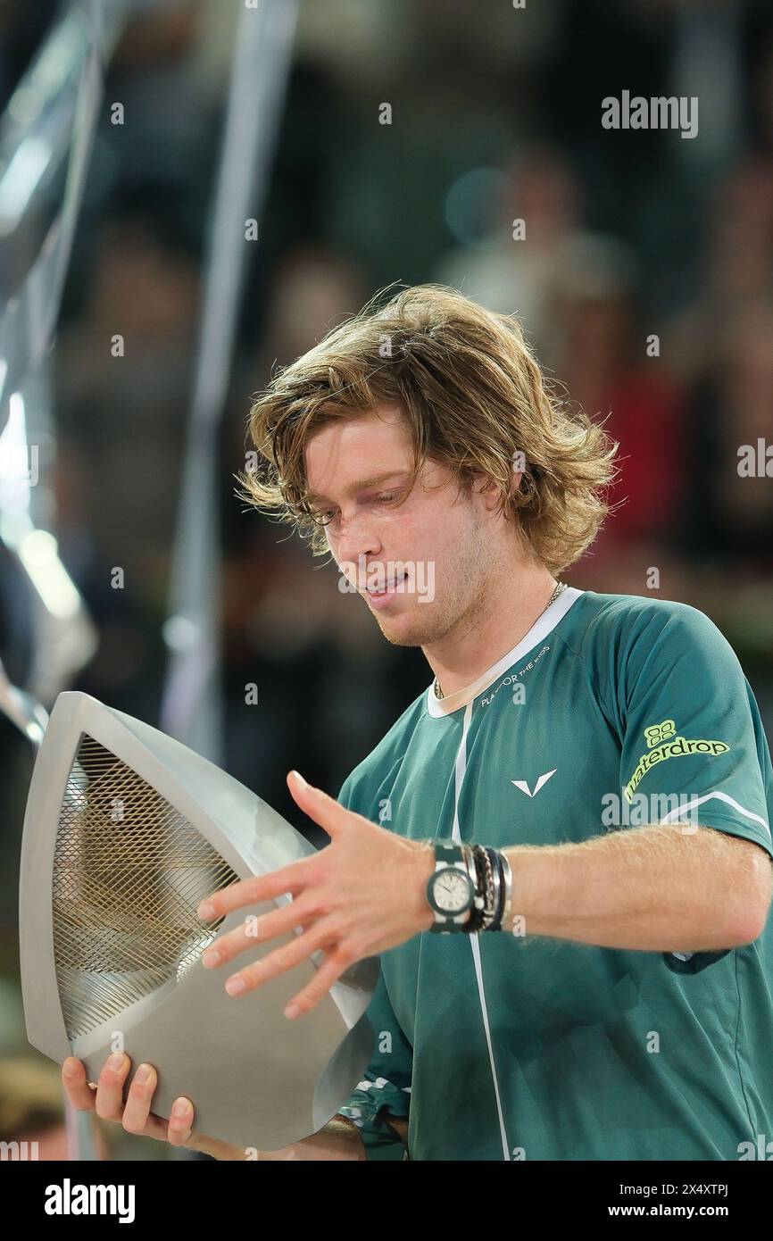 Andrey Rublev poses with the Mutua Madrid Open trophy following victory ...