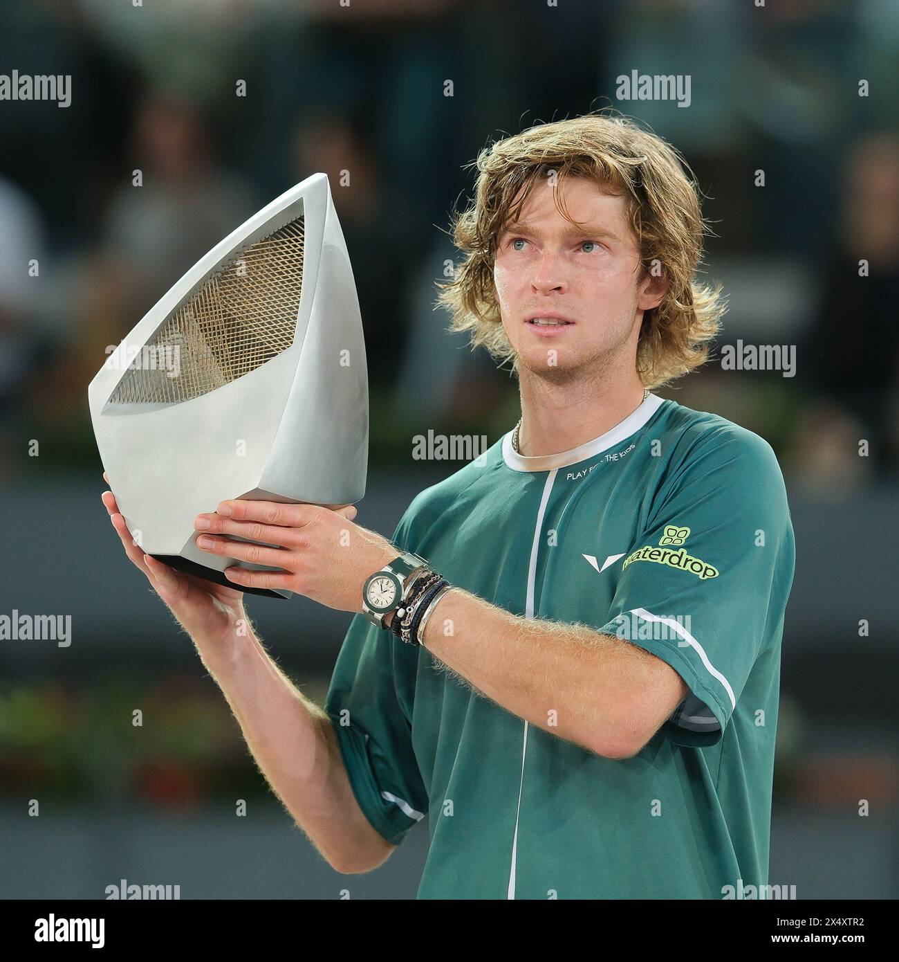 Andrey Rublev poses with the Mutua Madrid Open trophy following victory ...