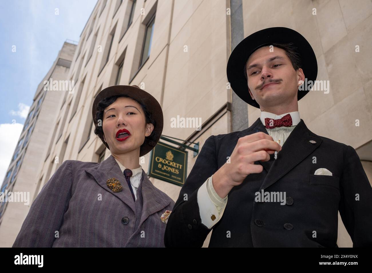 London, UK. 05th May, 2024. A lady and a gentleman wearing suits pose ...