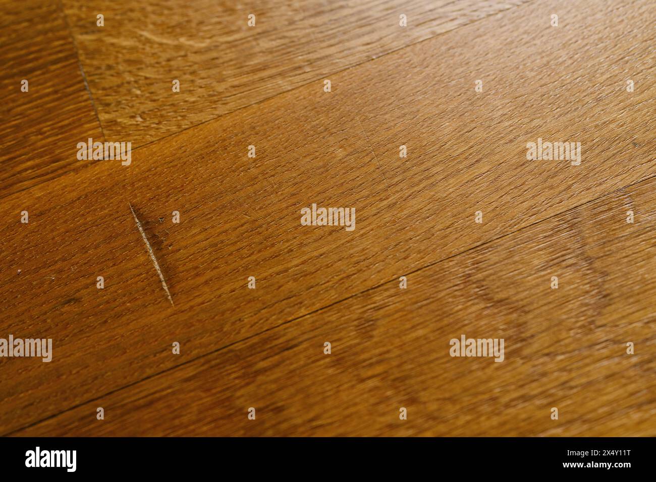 scratch on a parquet floor, by use with defect emphasizing the texture ...