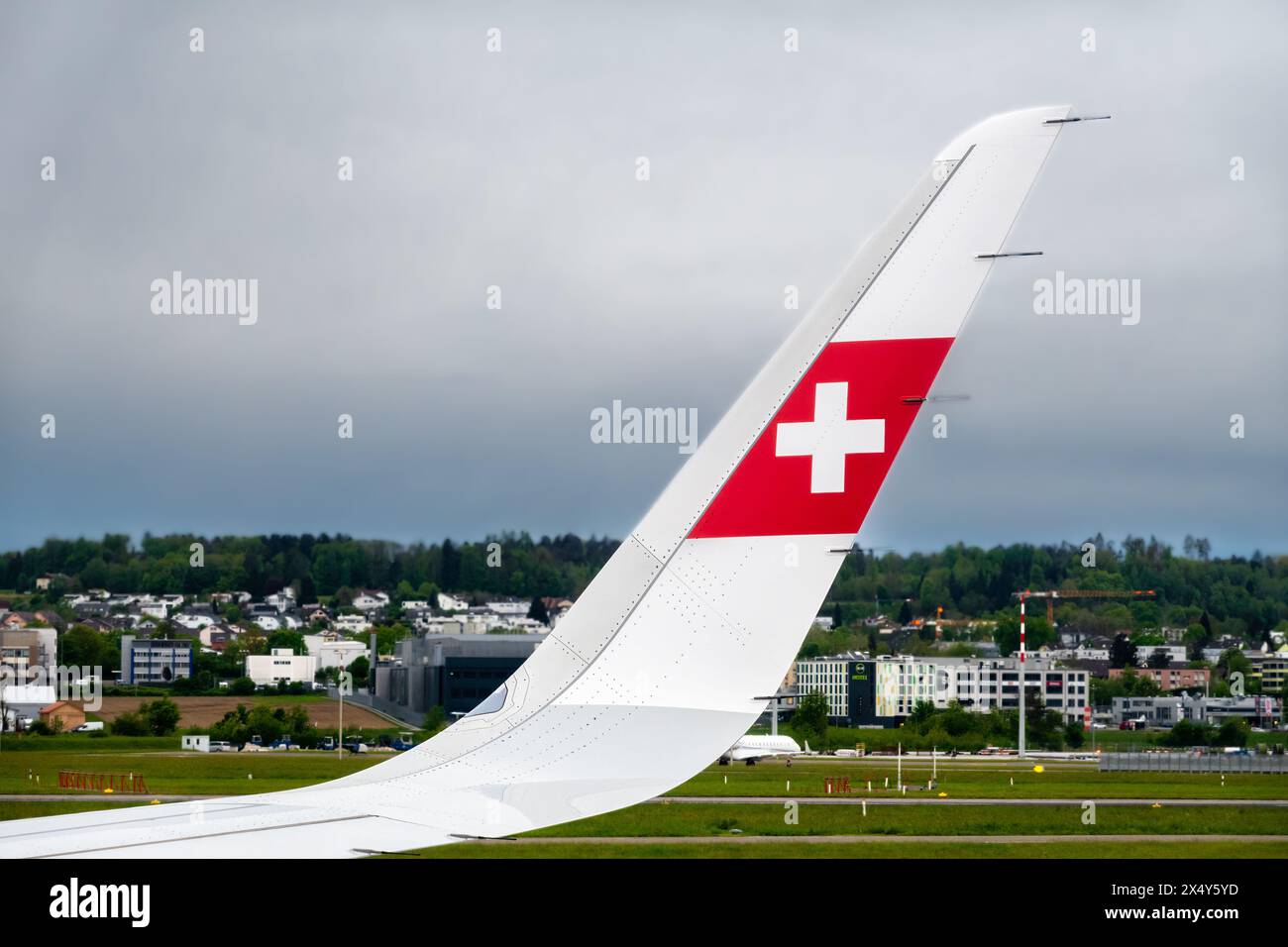 Zurich, Switzerland - April 28, 2024: Airplane with the symbol of the ...