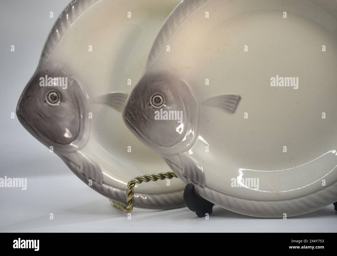 antique porcelain plates shaped like fish Stock Photo - Alamy