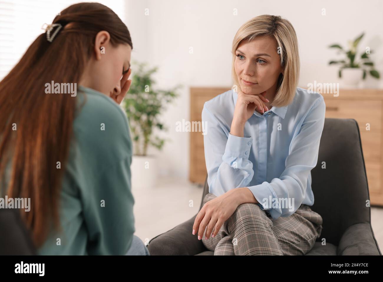 Professional psychotherapist working with patient in office Stock Photo ...