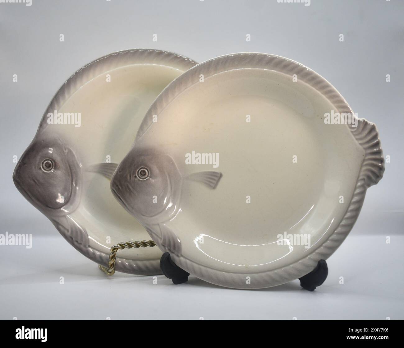 antique porcelain plates shaped like fish Stock Photo - Alamy