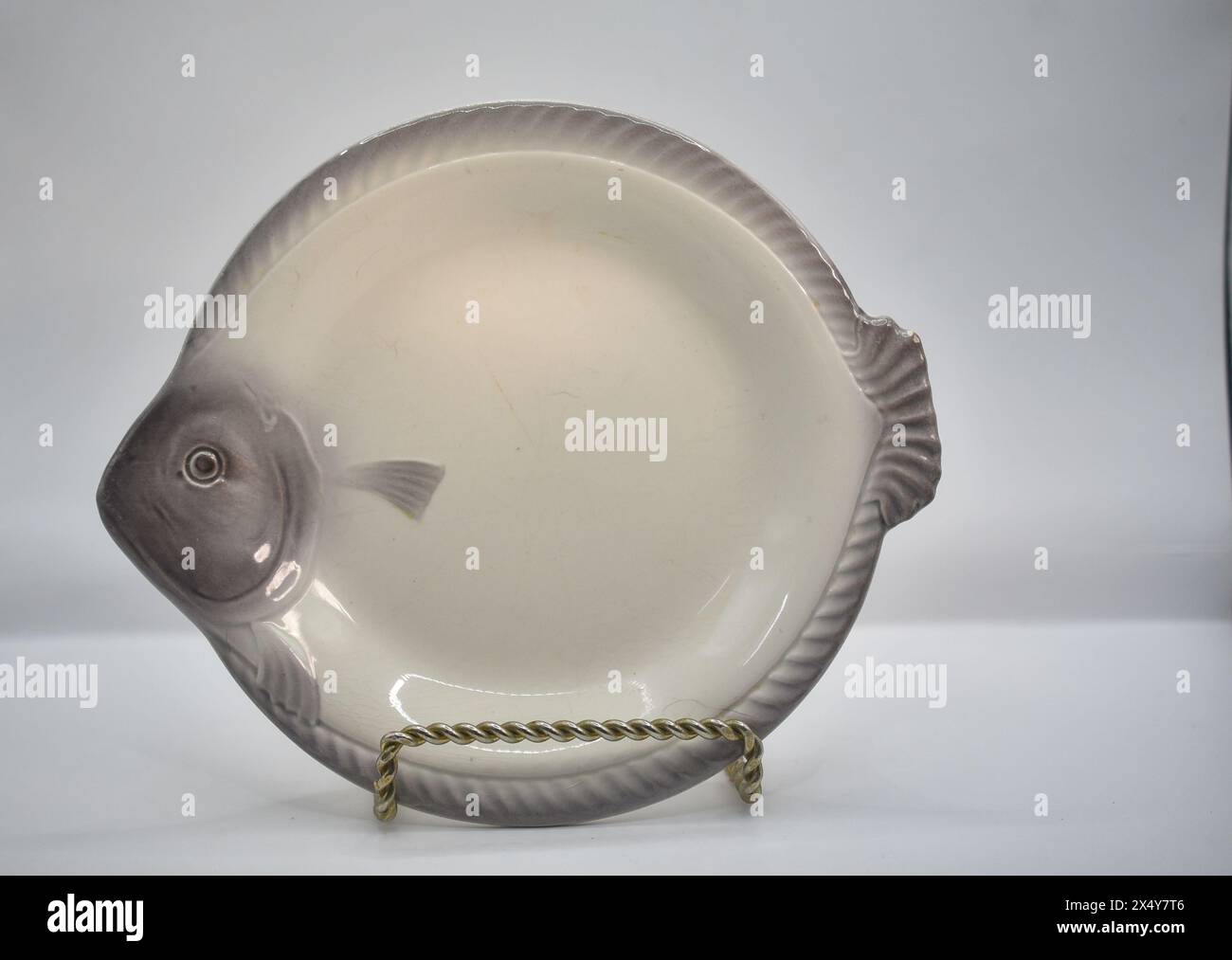 antique porcelain plates shaped like fish Stock Photo - Alamy