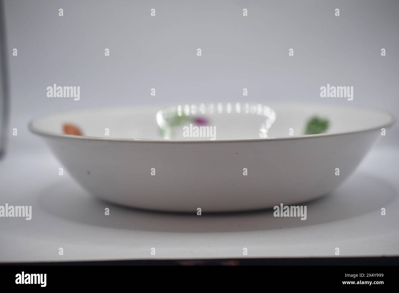 retro serving bowl with vegetable design on inside Stock Photo - Alamy