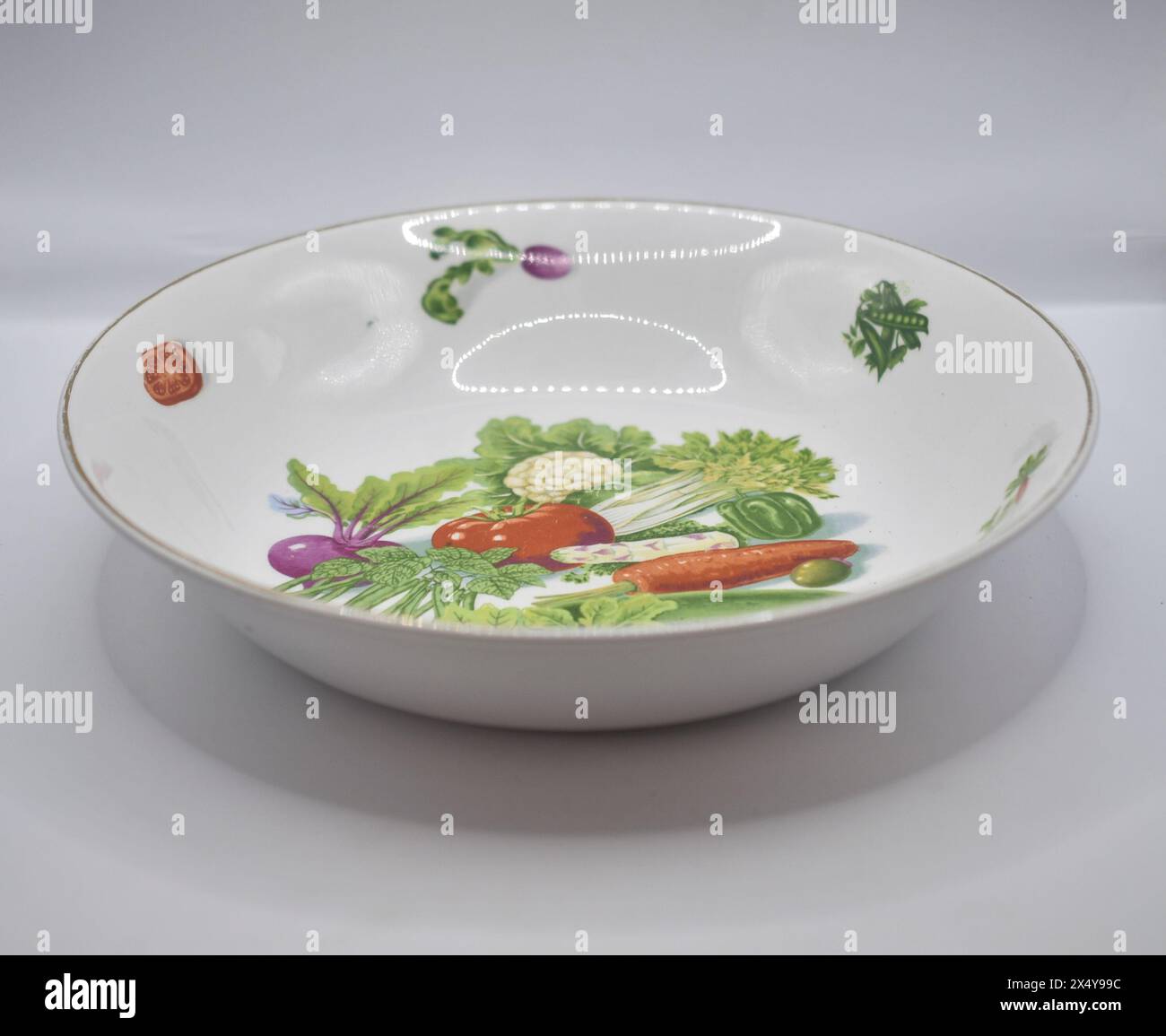 retro serving bowl with vegetable design on inside Stock Photo - Alamy
